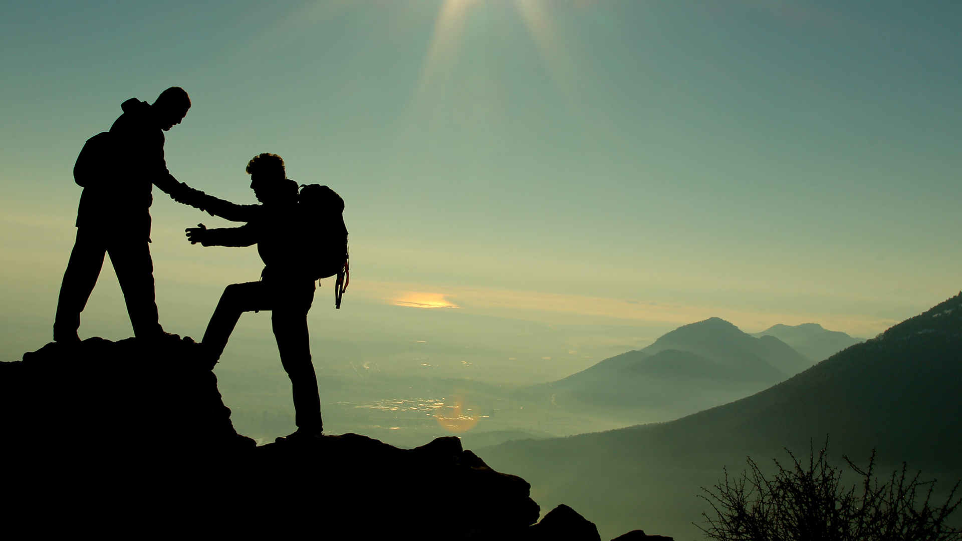 climbers-silhouette-hands-sun - John Erickson, MD